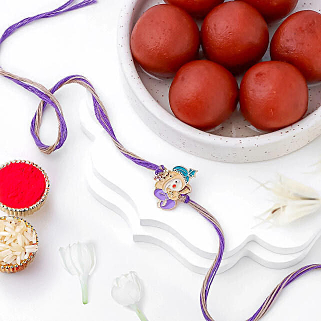 Bal Ganesha Cheerful Charm Rakhi & Sweet Treat brazil | Gift Bal ...