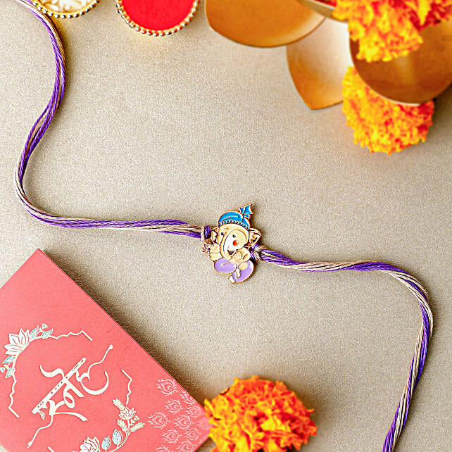 Bal Ganesha Cheerful Charm Rakhi denmark | Gift Bal Ganesha Cheerful ...