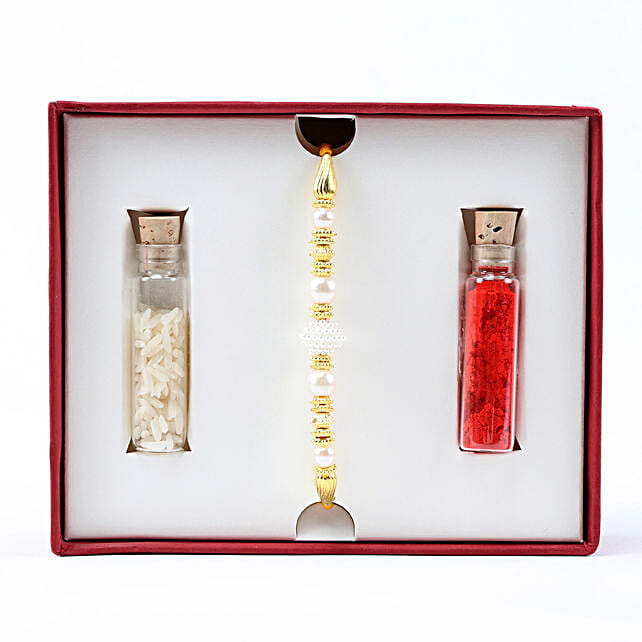 Buy/Send Designer Plastic Moti Rakhi Online- FNP