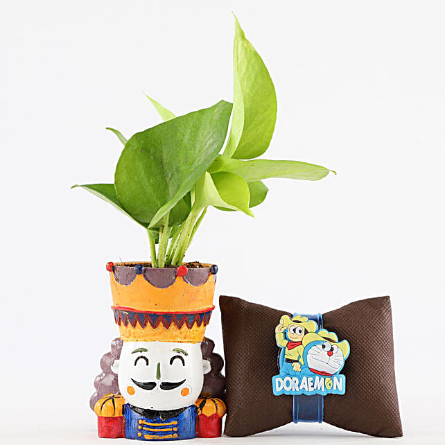 Buy/Send Money Plant In King Resin Pot Glowing Doremon Rakhi Online- FNP