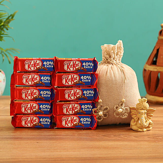 Buy/Send Beige Ganesha Idol & Kitkat In Fancy Potli Online- FNP