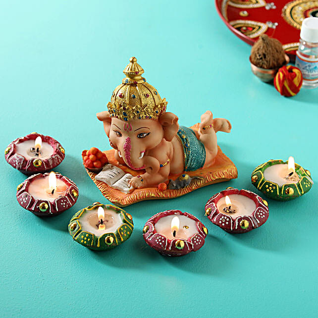 Buy/Send Reading Ganesha & Designer Wax Diyas Online- FNP