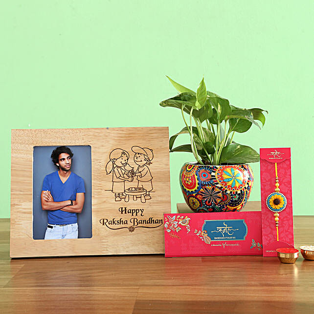 Buy/Send Sunflower Rakhi With Money Plant & Personalised Frame Online- FNP
