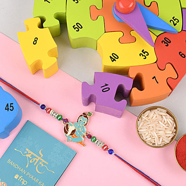 Buy/Send Sneh Bal Krishna Rakhi with Jigsaw Puzzle Gift Set Online- FNP