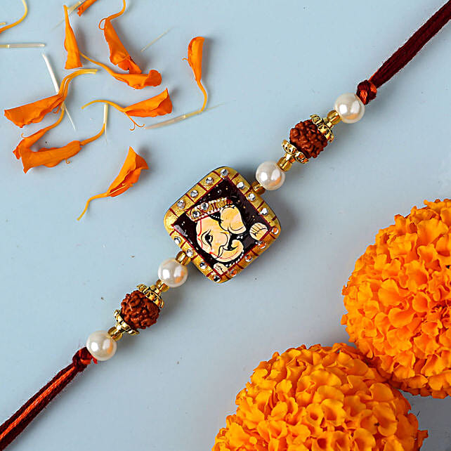 Buy/Send Divine Rudra Ganesha Pearl Rakhi Online- FNP