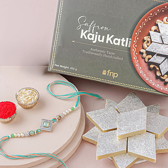Buy/Send Regal American Diamond Studded Rakhi & Kesar Kaju Katli Online ...