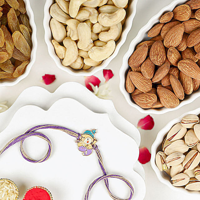 Bal Ganesha Cheerful Charm Rakhi & Nutty Treasures norway | Gift Bal ...