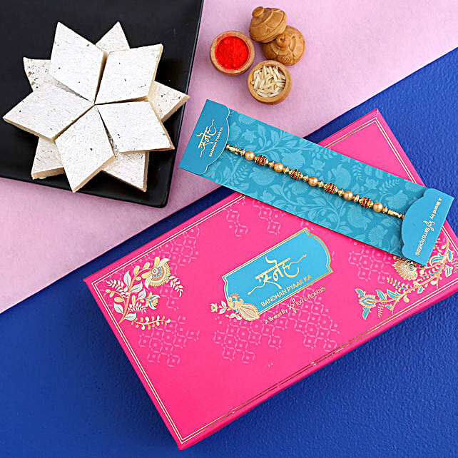 Traditional Golden Pearl Rakhi With 250 Gms Kaju Katli qatar | Gift ...