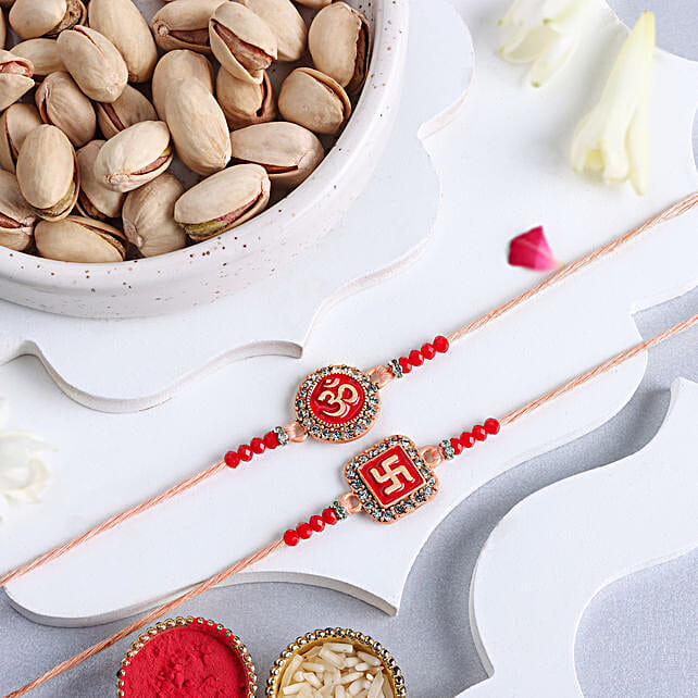 Ethereal Om Swastik Pair Rakhi & Pistachio Delight switzerland | Gift ...
