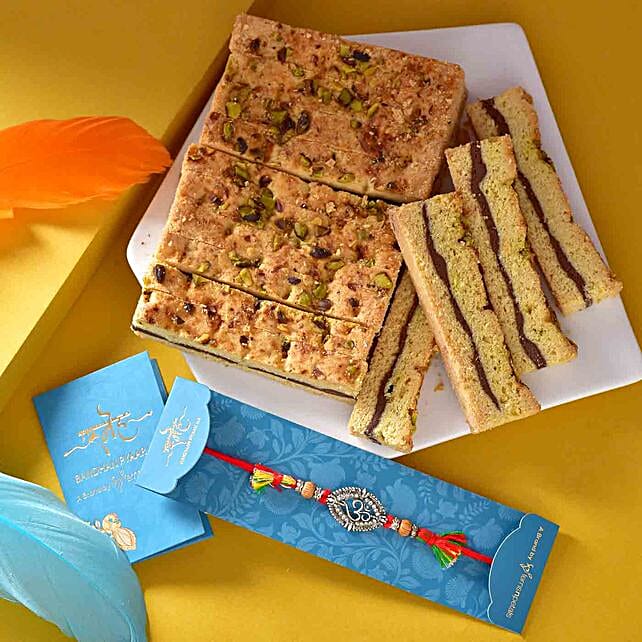 Sneh Antique Silver Om Rakhi & Pistachio Biscuit Cake thailand | Gift ...