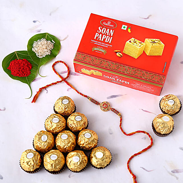 Sneh Traditional Om Rakhi with 250 Grams Soan Papdi and 6 Ferrero ...