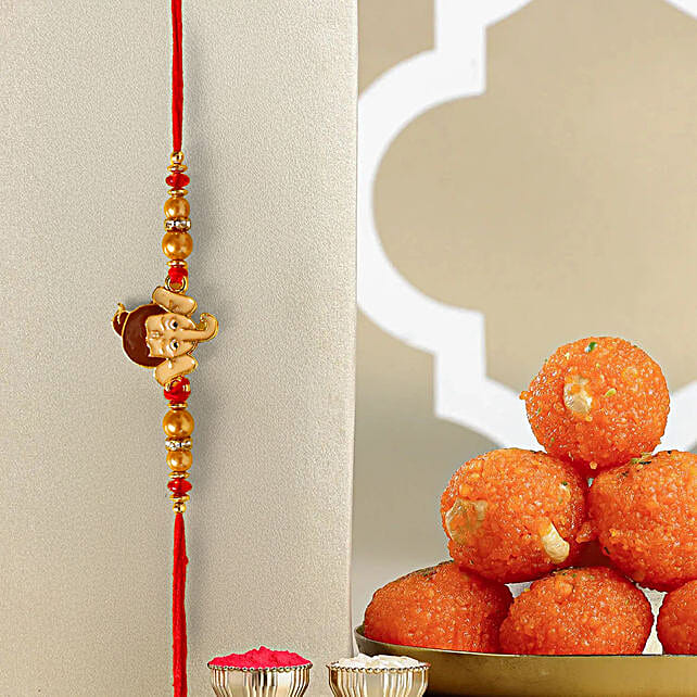 Long Trunk Bal Ganesha Pearl Rakhi For Kids And Motichoor Ladoo uae ...
